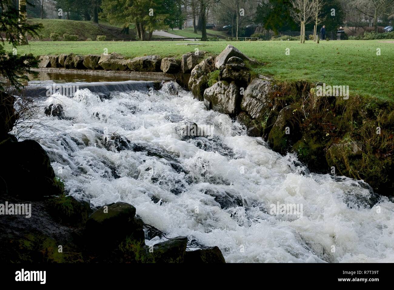 A fast-flowing stream in Pavilion Gardens, Buxton, Derbyshire Stock ...