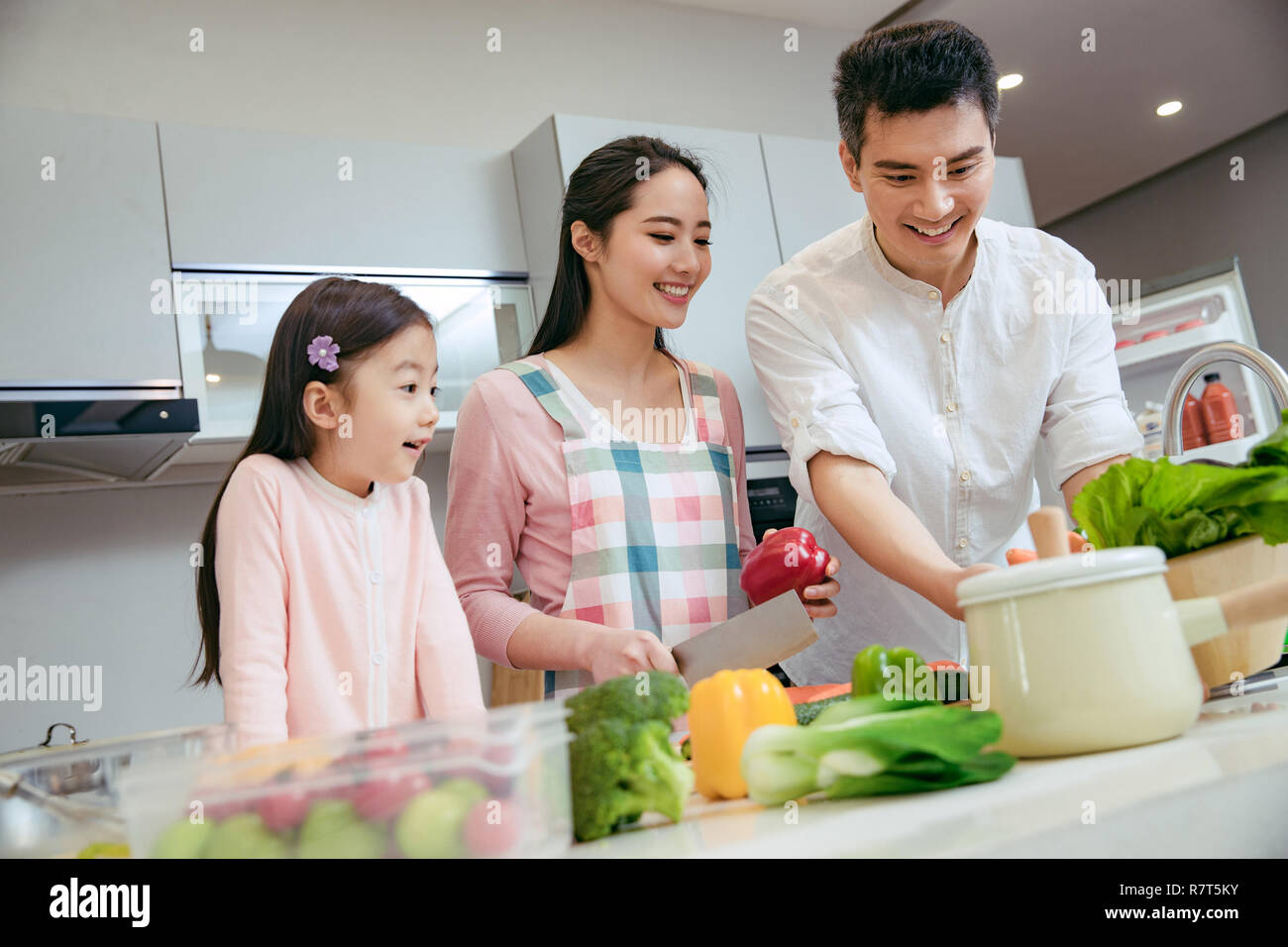 A happy family in the kitchen Stock Photo - Alamy