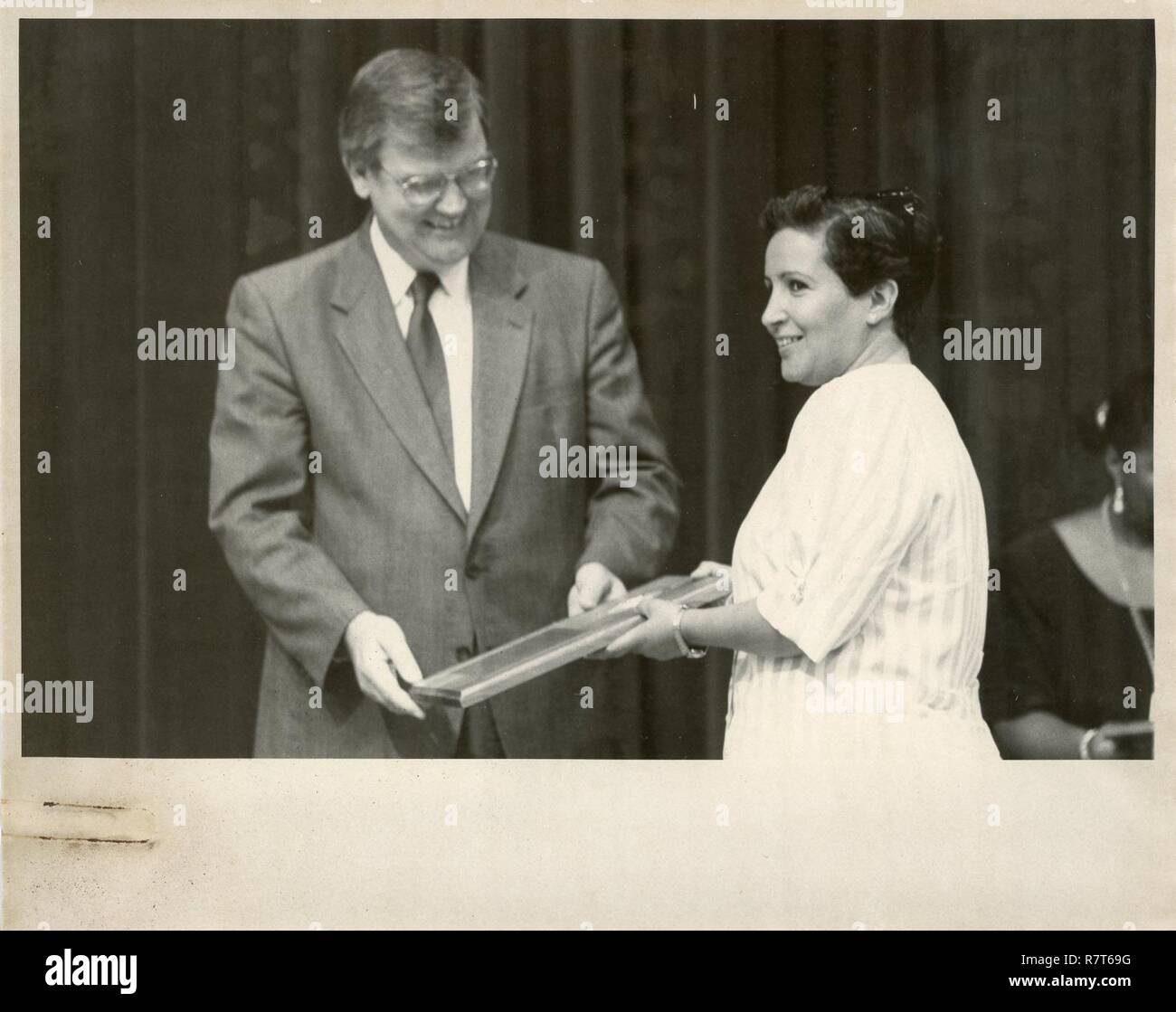woman receiving award from man Stock Photo - Alamy