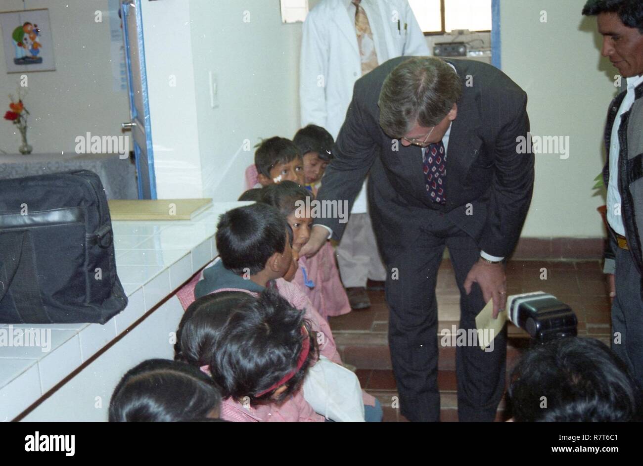 men talking to children Stock Photo - Alamy