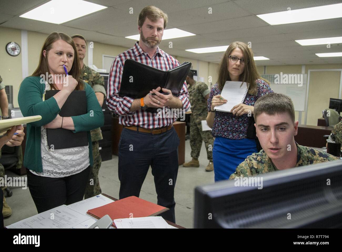 U.S. Marine Corps Lance Cpl. Christian Jacobs, procurement clerk, right ...