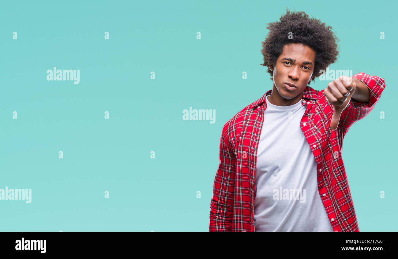 Afro american man over isolated background looking unhappy and angry ...