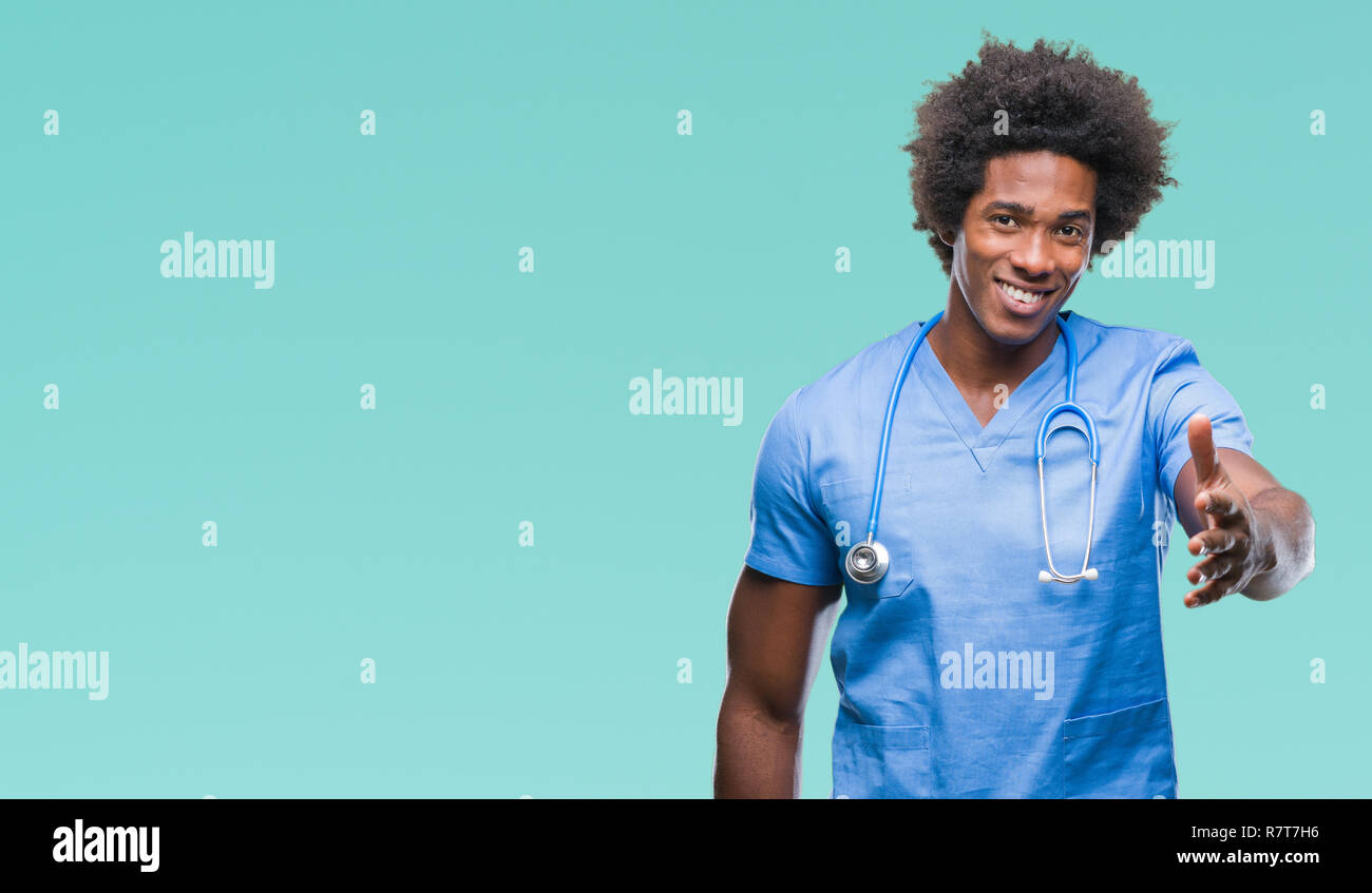 Afro american surgeon doctor man over isolated background smiling ...