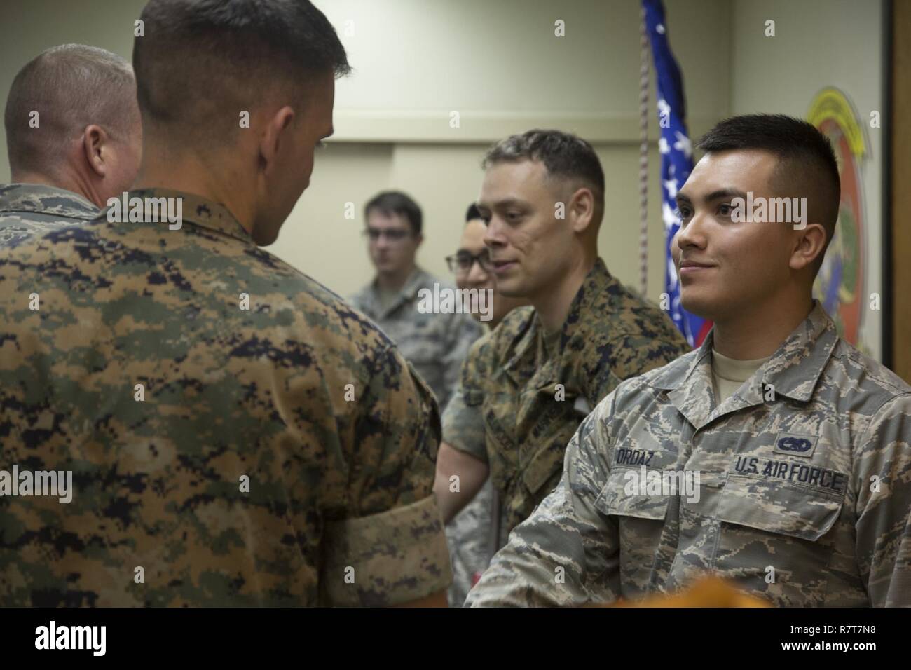 Airman 1st Class Andres Ordaz receives a Certificate of Commendation ...