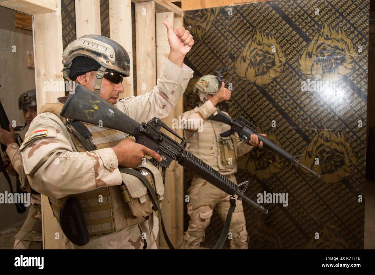 Iraqi security forces soldiers clear a building during the final ...