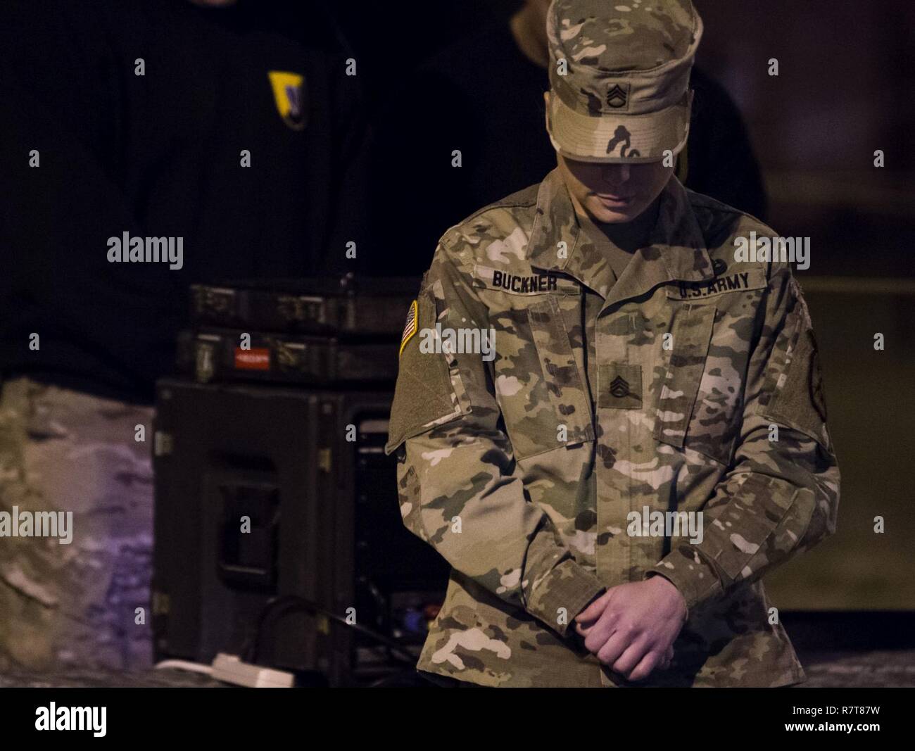 U.S. Army Staff Sergeant Kara Buckner bows her head during the ...