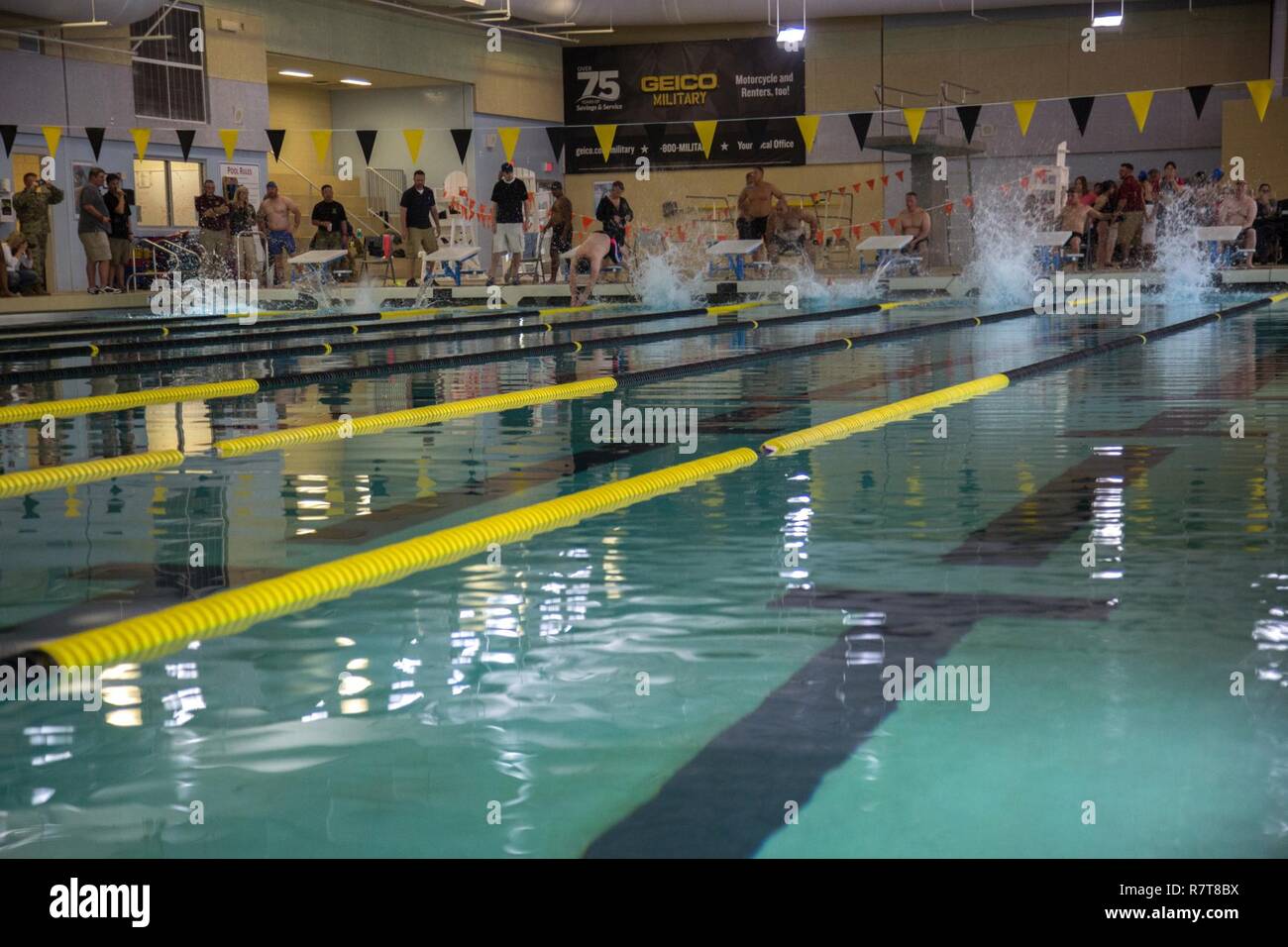 U.S. Army Soldiers and veterans compete in the swimming event at the ...