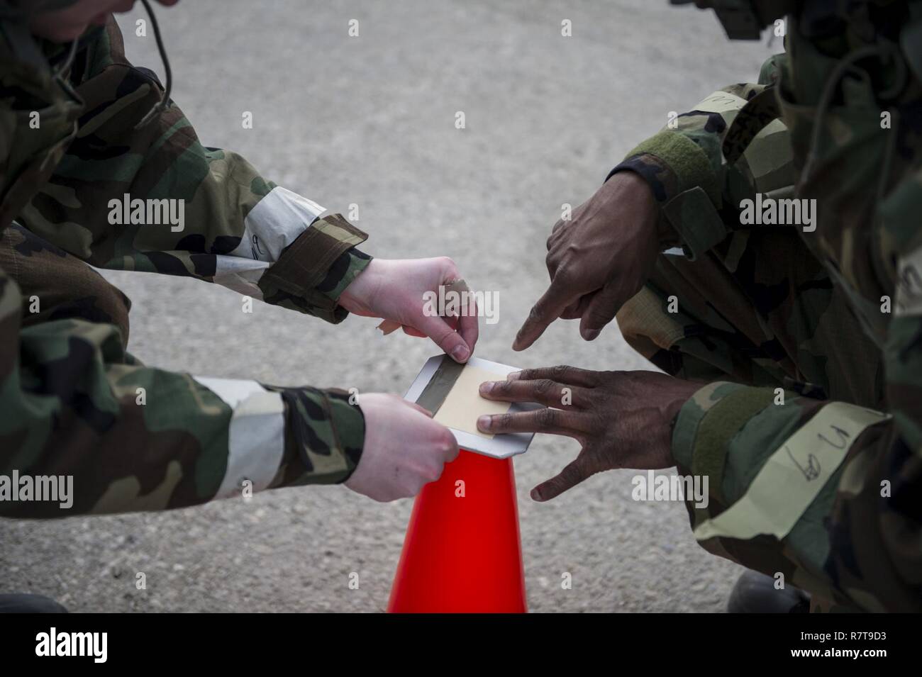 U.S. Air Force Airmen from the 354th Fighter Wing, put down M8 paper ...