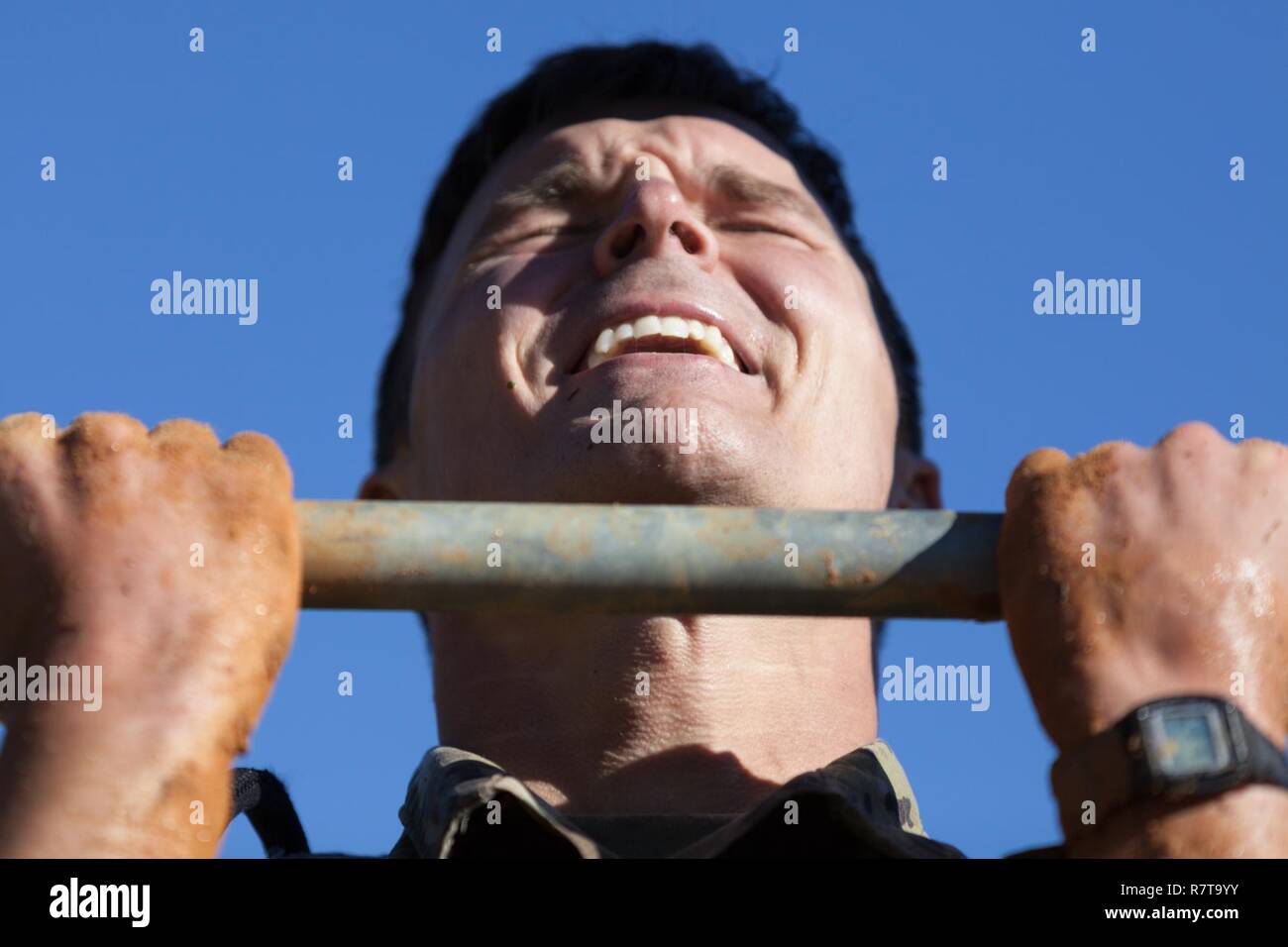 A U.S. Army Ranger performs a chin up during the Best Ranger ...