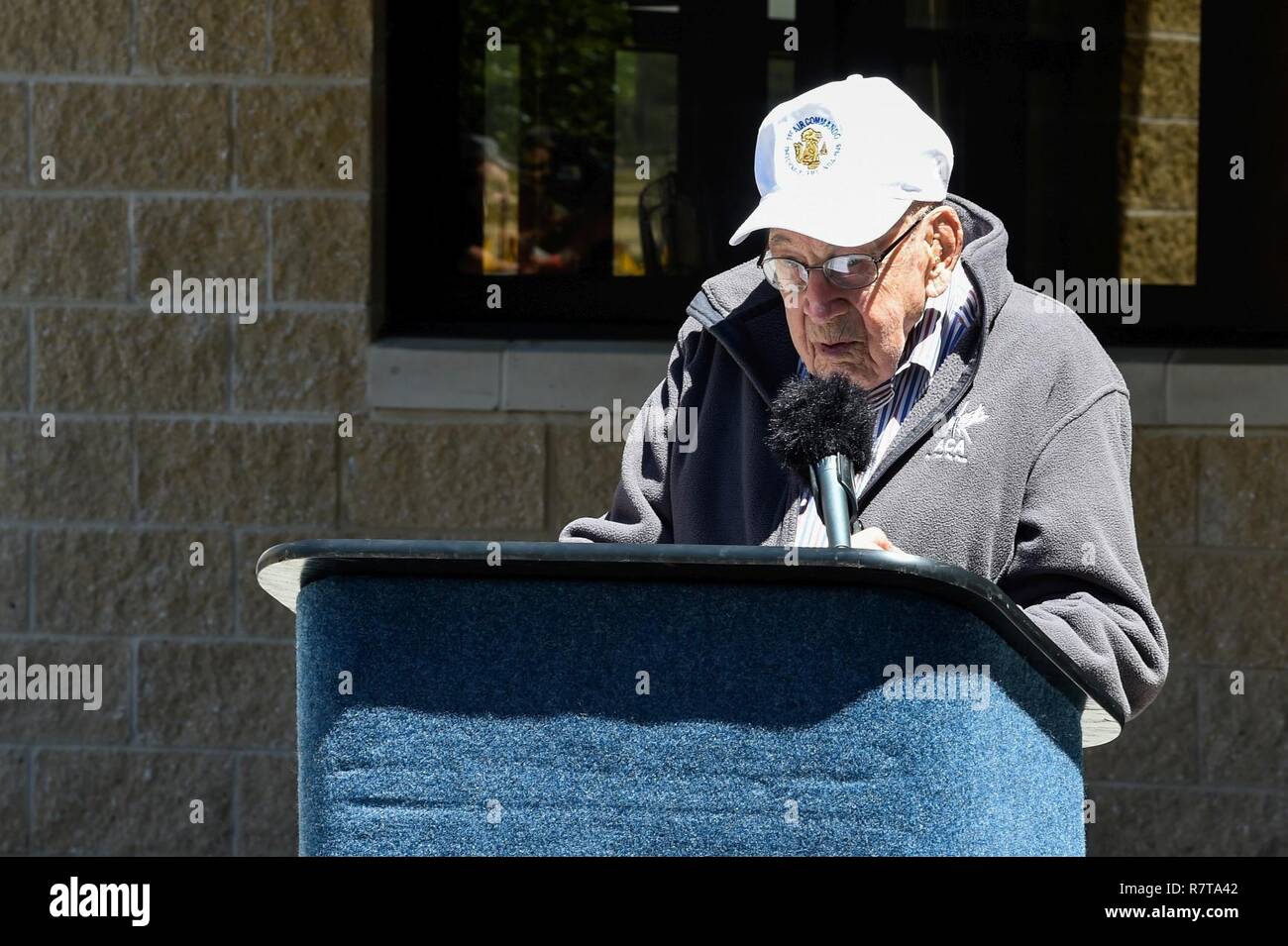 Retired Lt. Col. Richard E. Cole gives remarks after the unveiling of ...