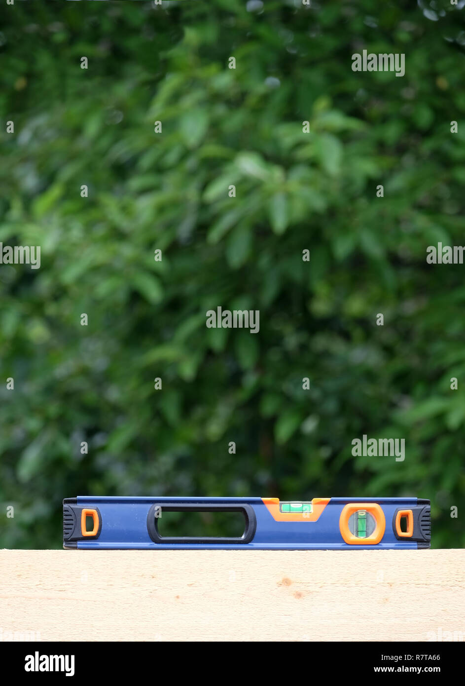 The building horizontal bubble level sits on a wooden beam, shows the ...
