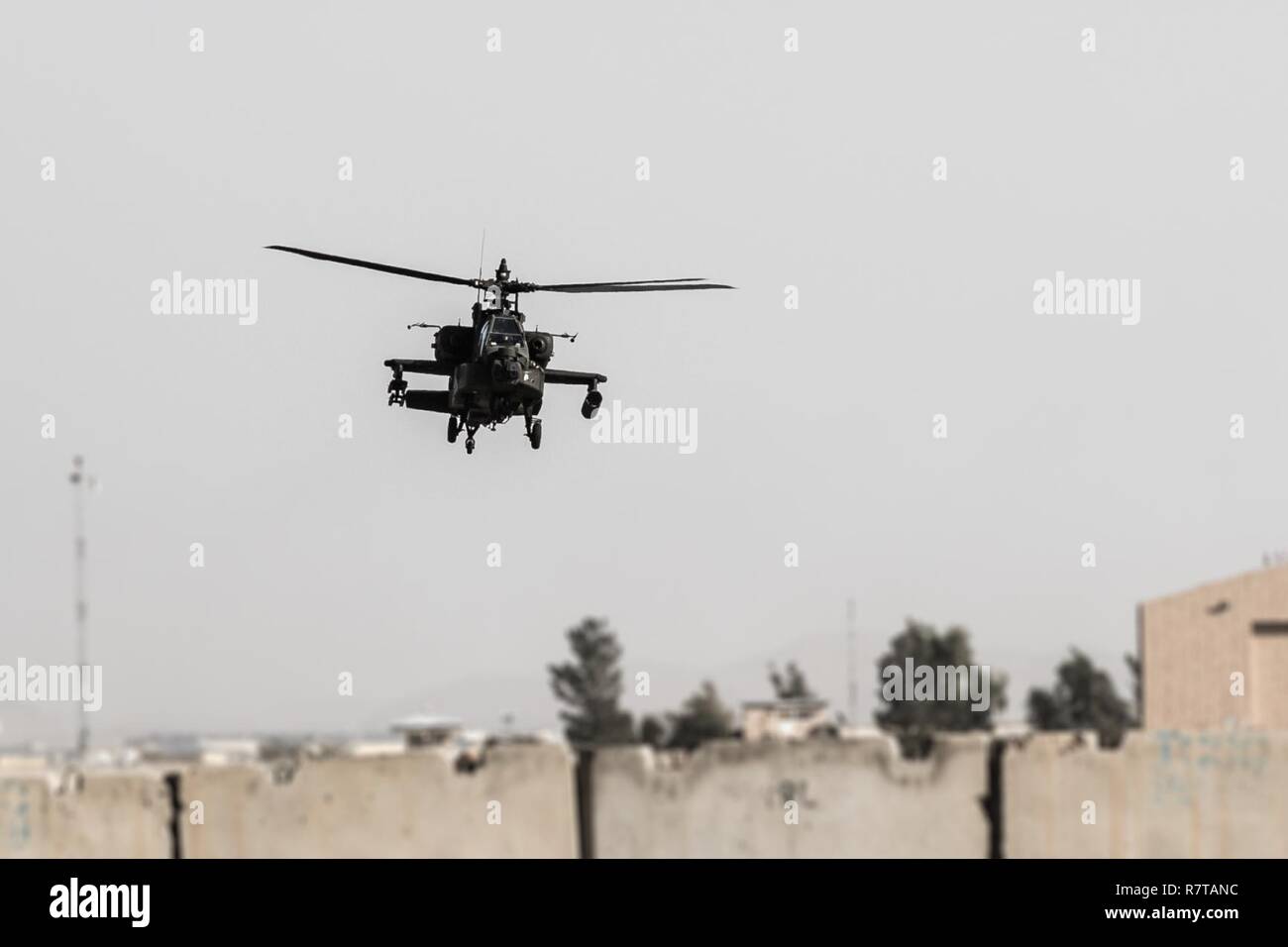 A U.S. Army AH-64 Apache helicopter crew takes flight at Kandahar ...