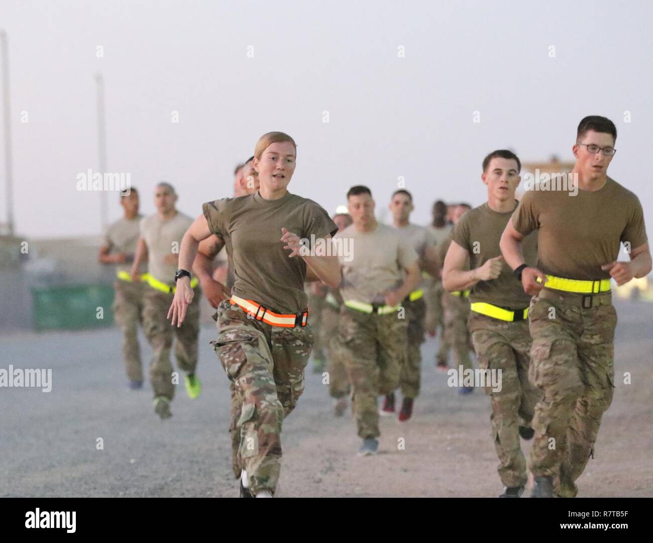 U.S. Servicemembers sprint to the finish line of a two-mile run during ...