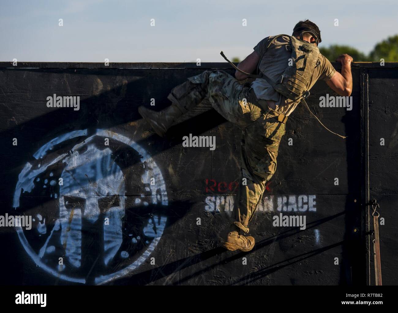 U.S. Army Rangers climb off an obstacle during a Spartan Race at the ...
