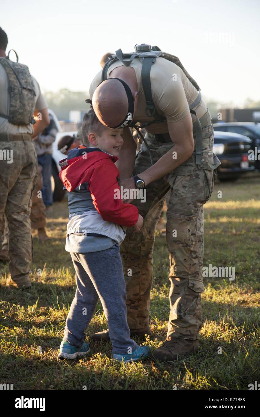 A U.S. Army Ranger greets his son prior to competing in the Spartan ...