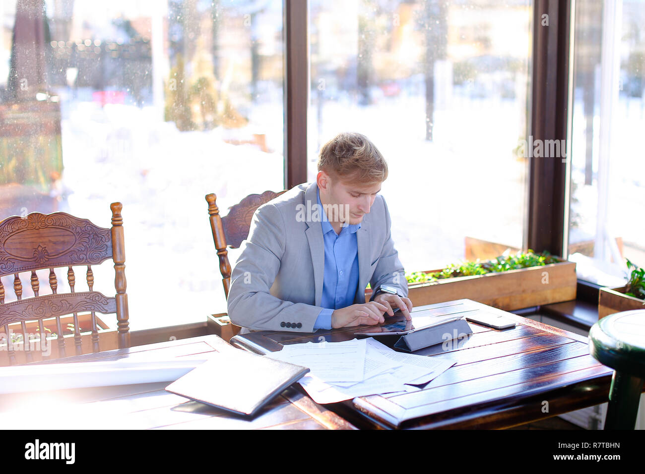 Young student preparing before exam in fast motion at cafe with Stock ...