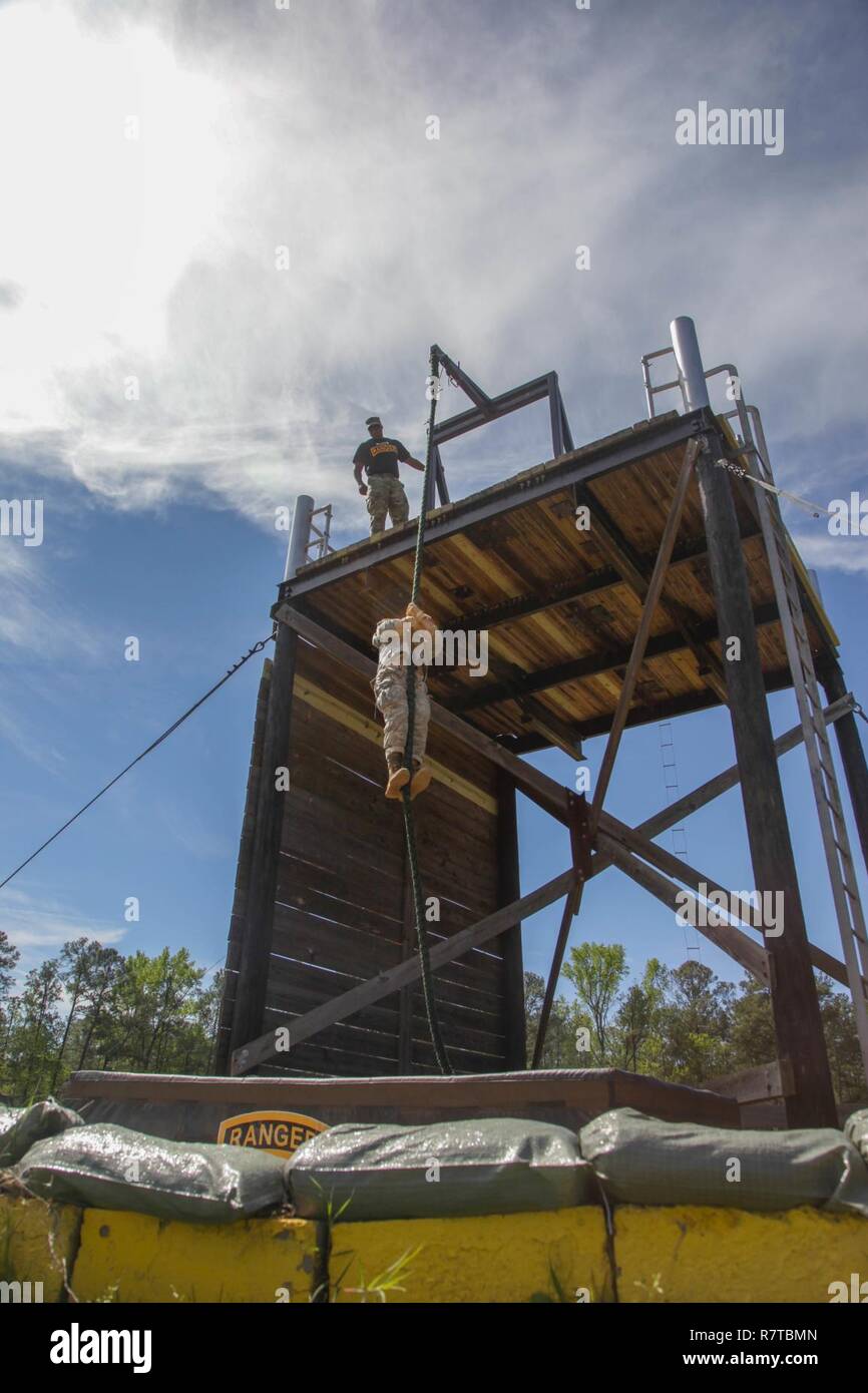 A U.S. Army Ranger slides down a rope on the Tri-Tower Challenge during ...