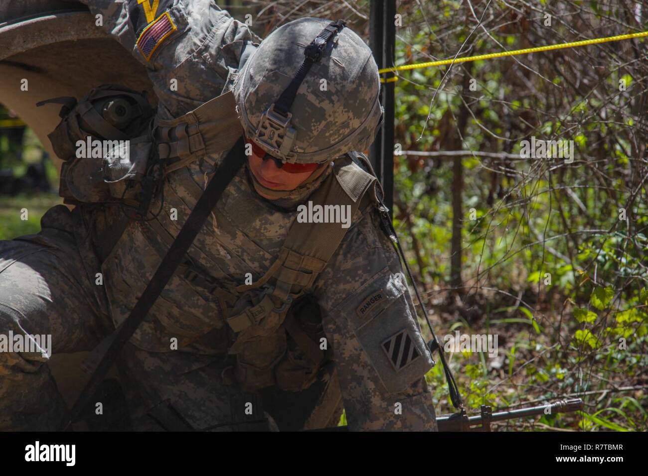 A U.S. Army Ranger assigned to the 3rd Infantry Divisions climbs from a ...