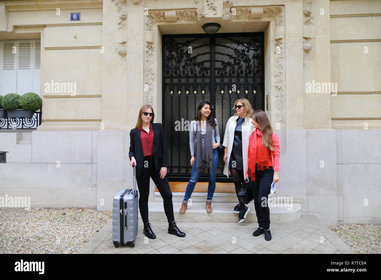 Happy students leaving university building in Stock Photo - Alamy