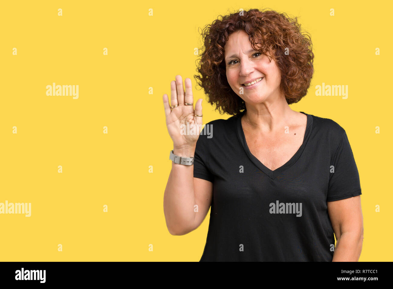 Beautiful middle ager senior woman over isolated background Waiving ...