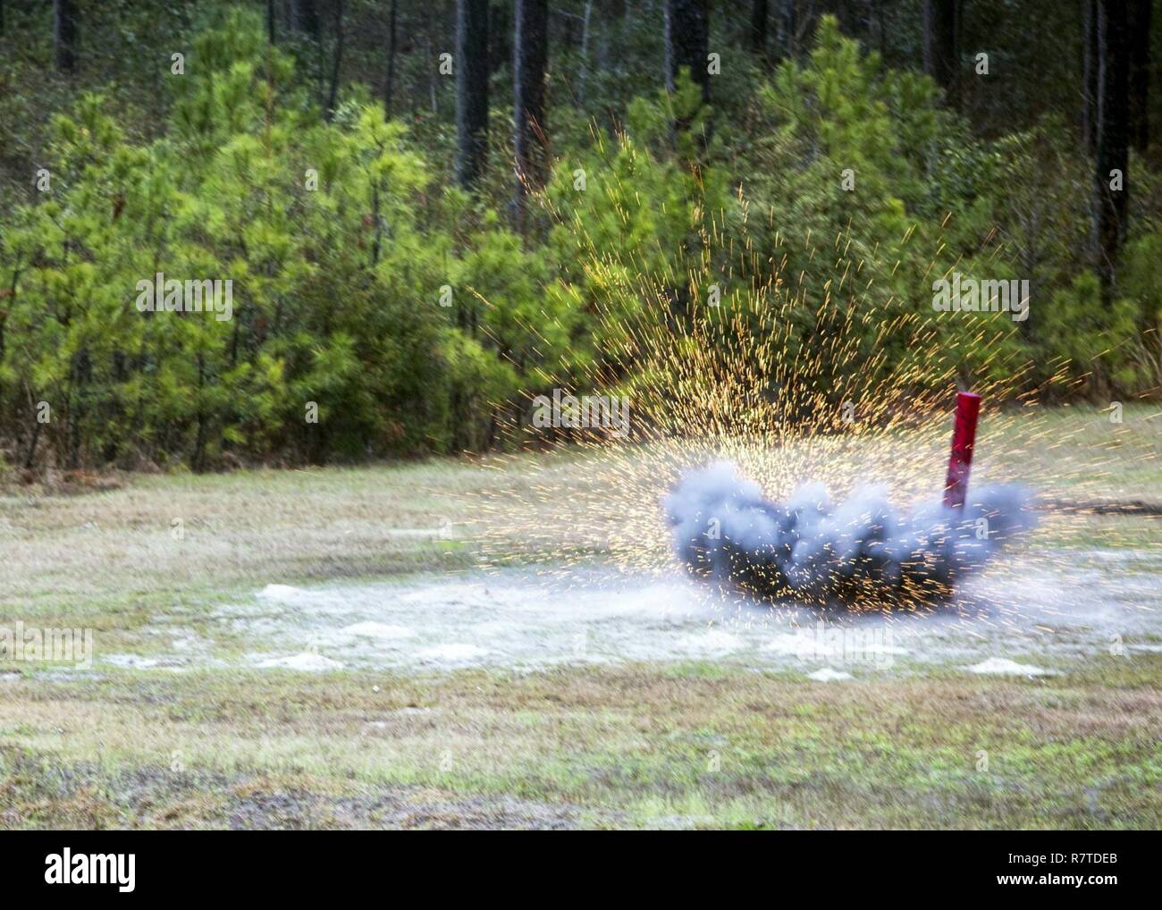 An M67 fragmentation grenade explodes after being thrown by a Marine ...