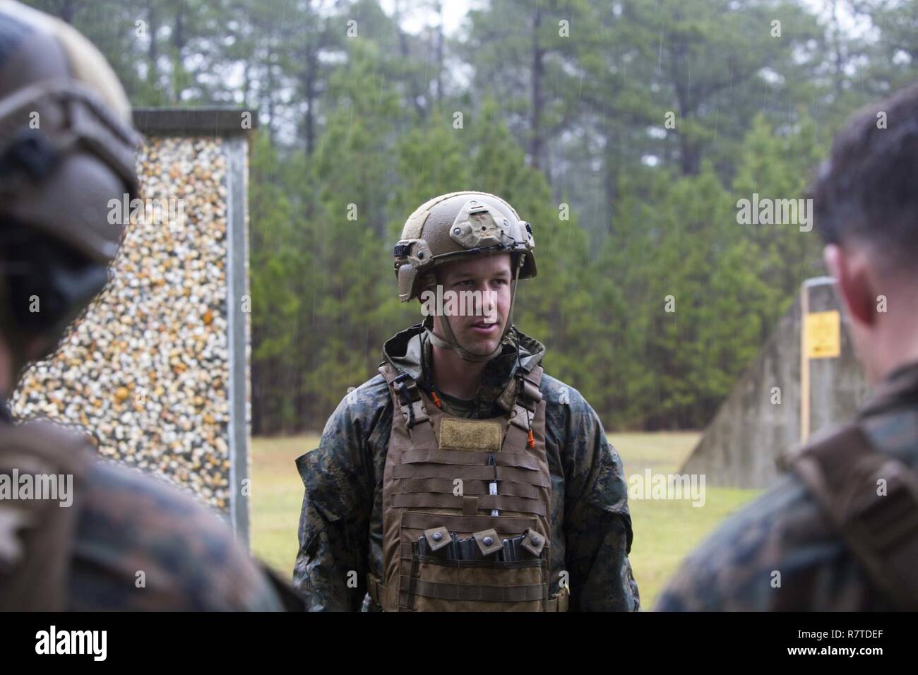Capt. Aaron D. Foote briefs the Marines after a grenade range at Camp ...