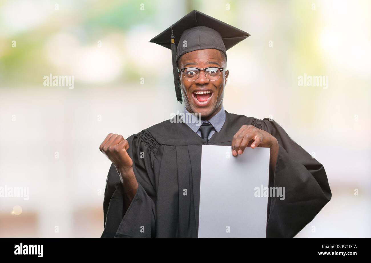 Young graduated african american man holding blank paper degree over ...