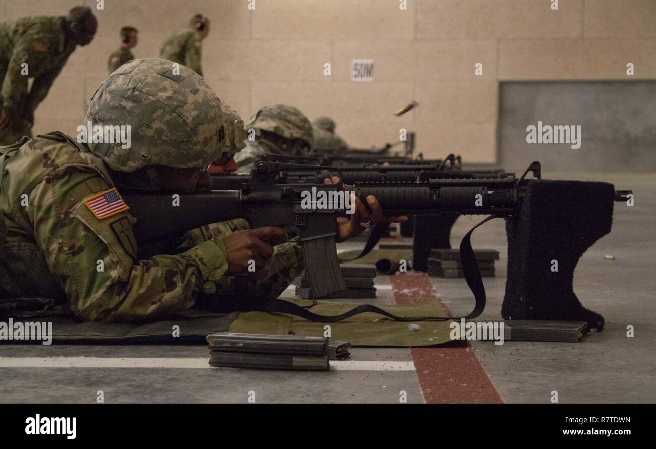 A 5.56 mm shell casing flies as Army Capt. Kewanda L. Broadwater, an ...