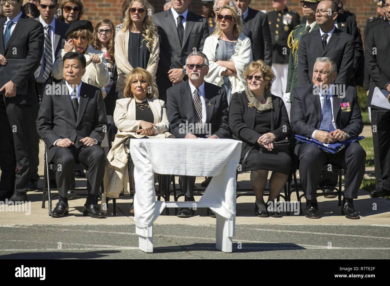 Retired U.S. Marine Corps Lt. Col. John S. Snowden sits with family and ...