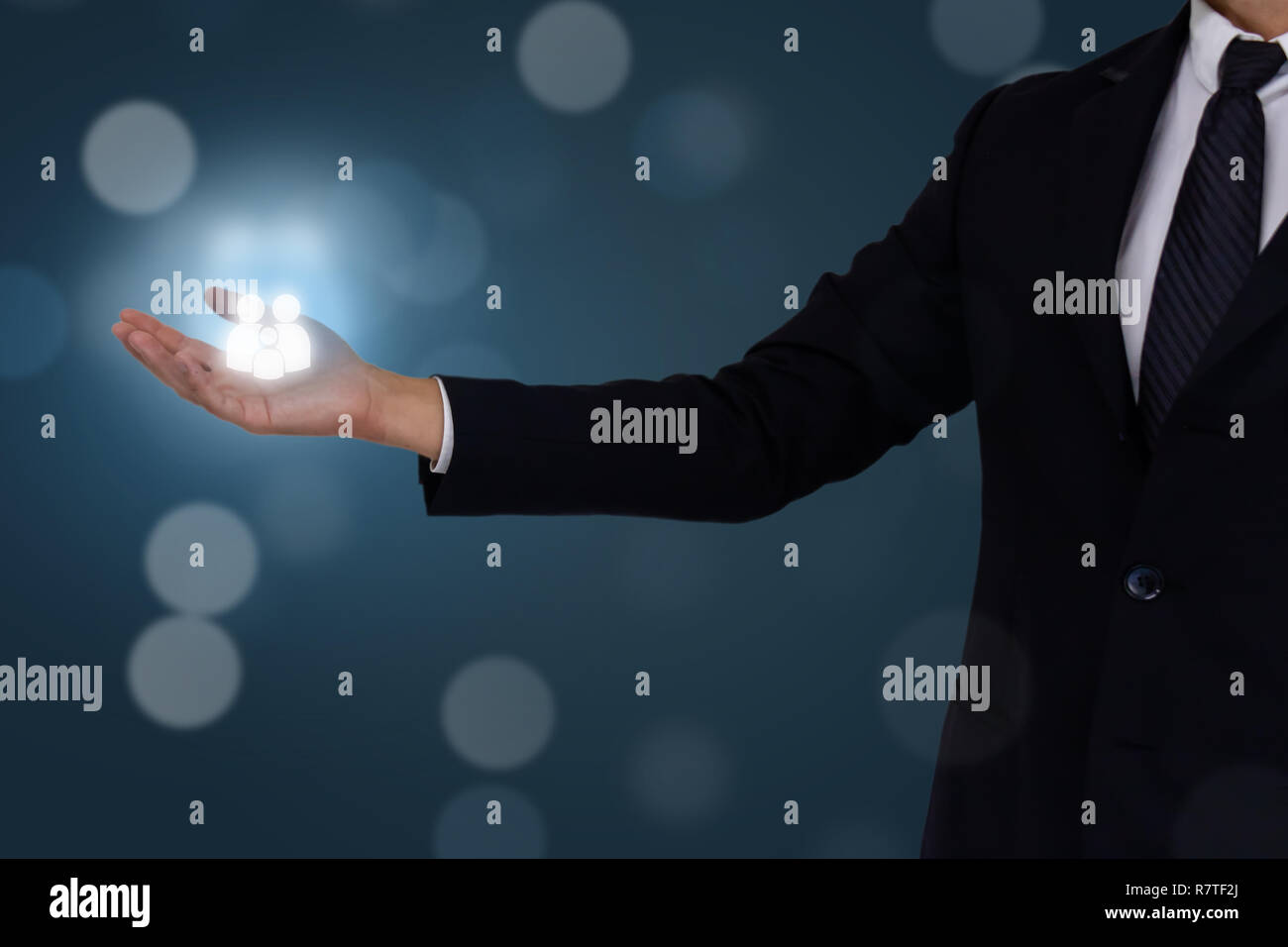 Insurance concept, business man hand holding the family insurance icon ...