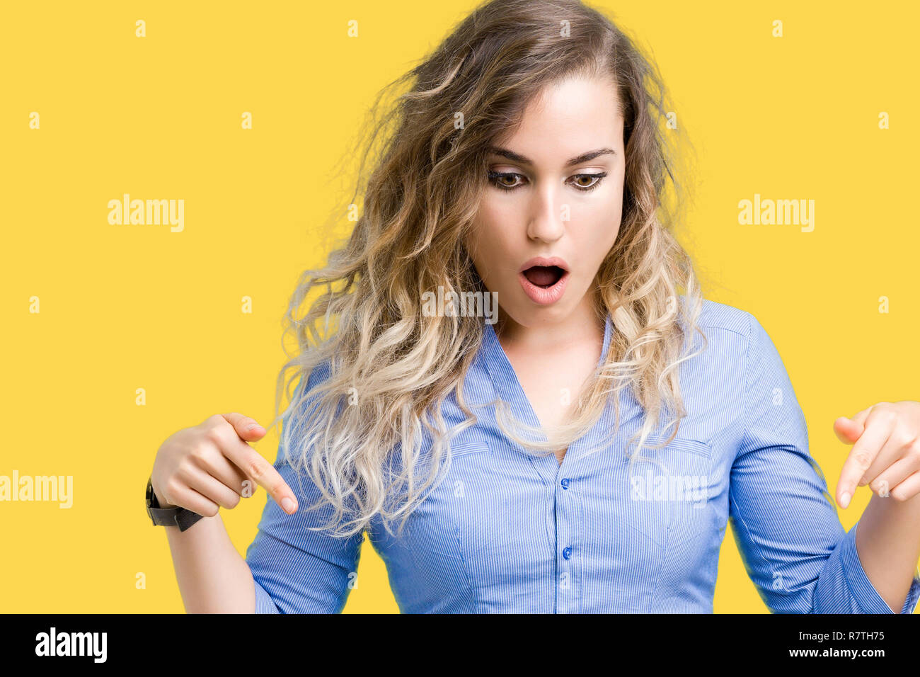 Beautiful young blonde business woman over isolated background Pointing ... Beautiful young blonde business woman over isolated background Pointing ...