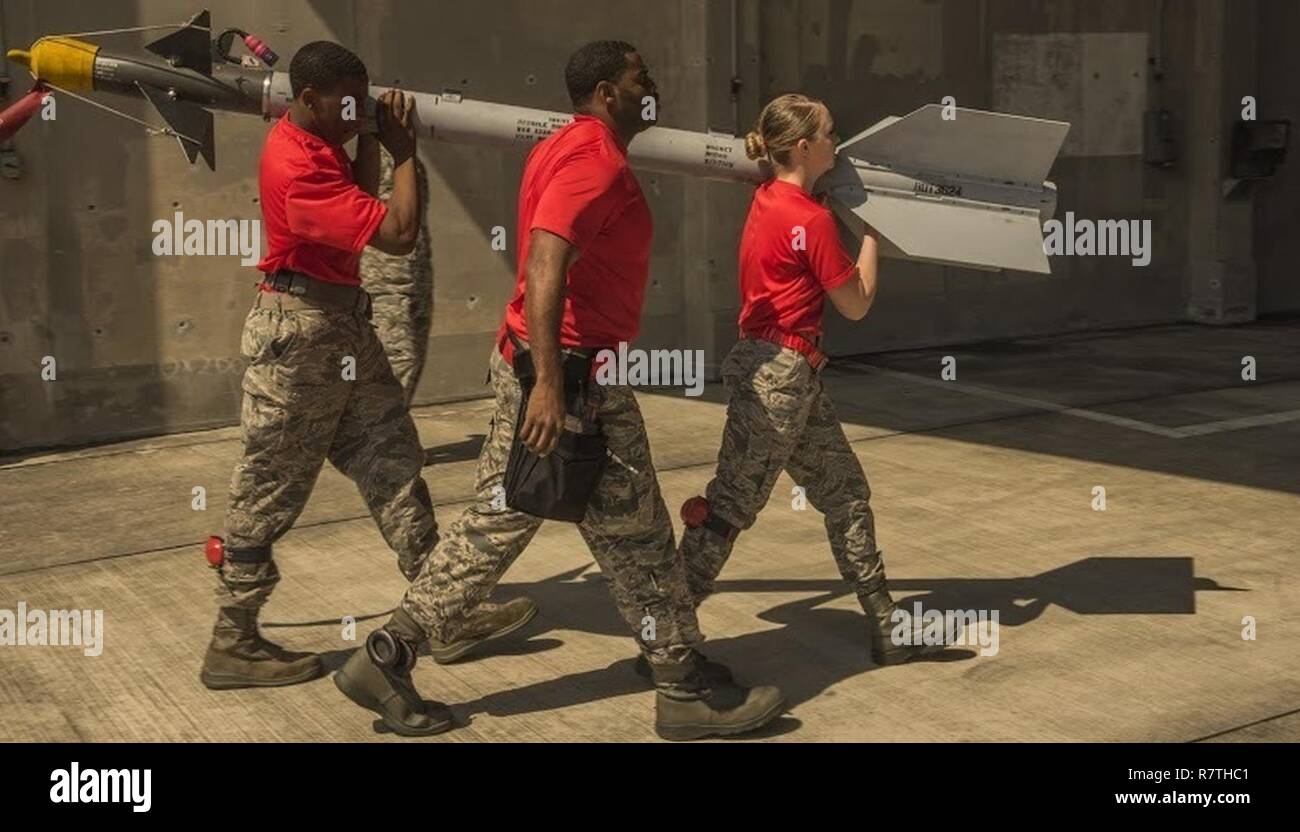A U.S. Air Force weapons load crew team from the 67th Aircraft ...