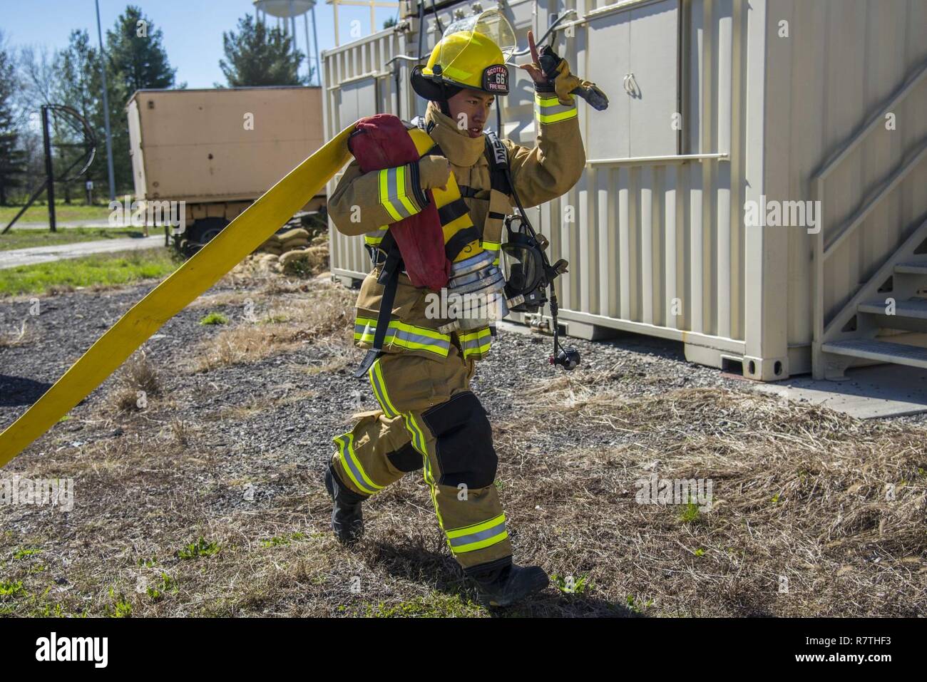 Firefighters with the 375th Civil Engineer Squadron perform drills in ...