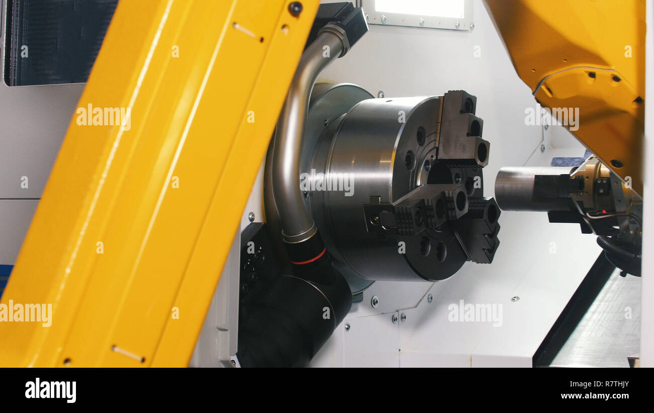 Big yellow industrial machine connecting its parts Stock Photo - Alamy