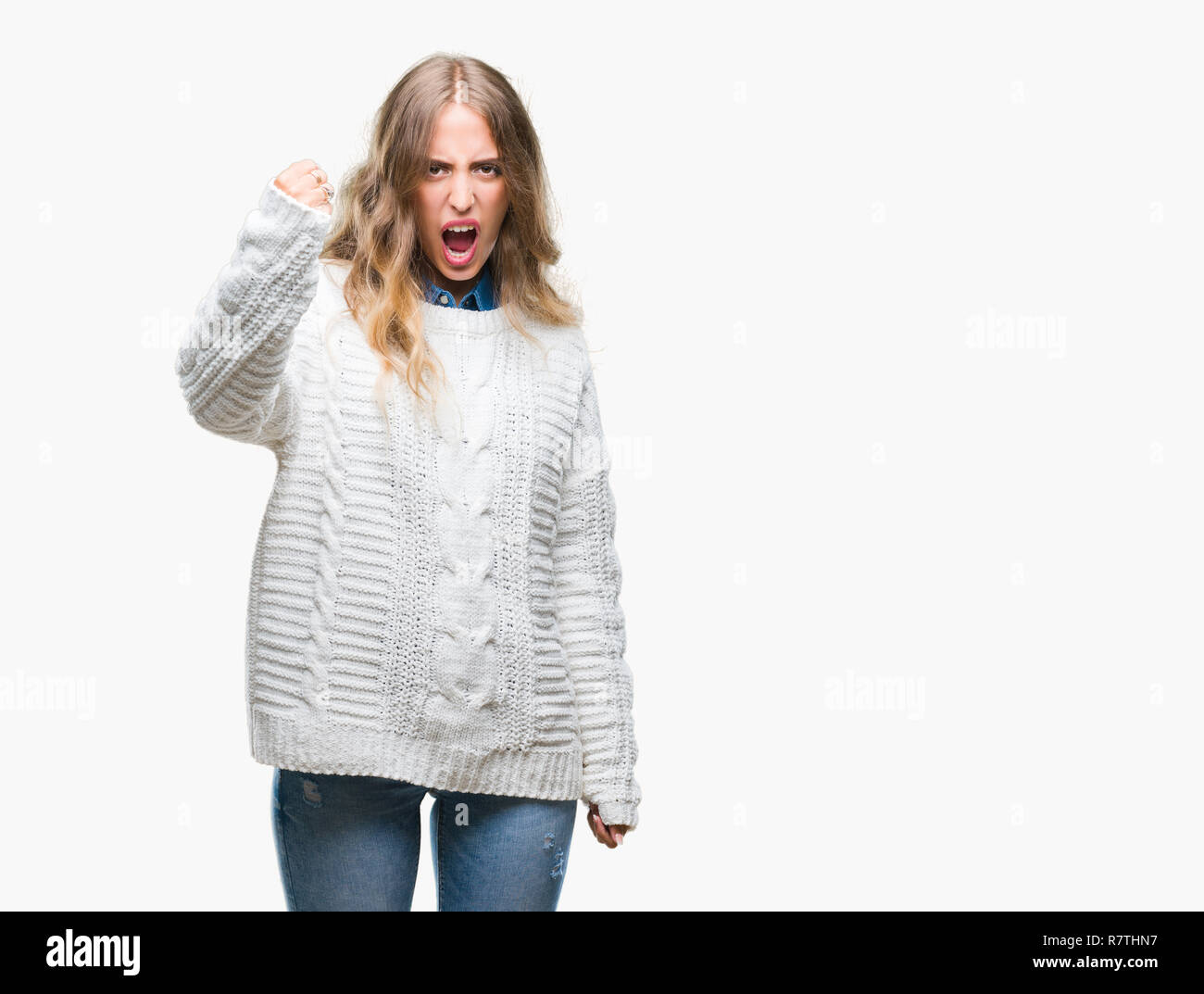 Beautiful young blonde woman wearing winter sweater over isolated ...