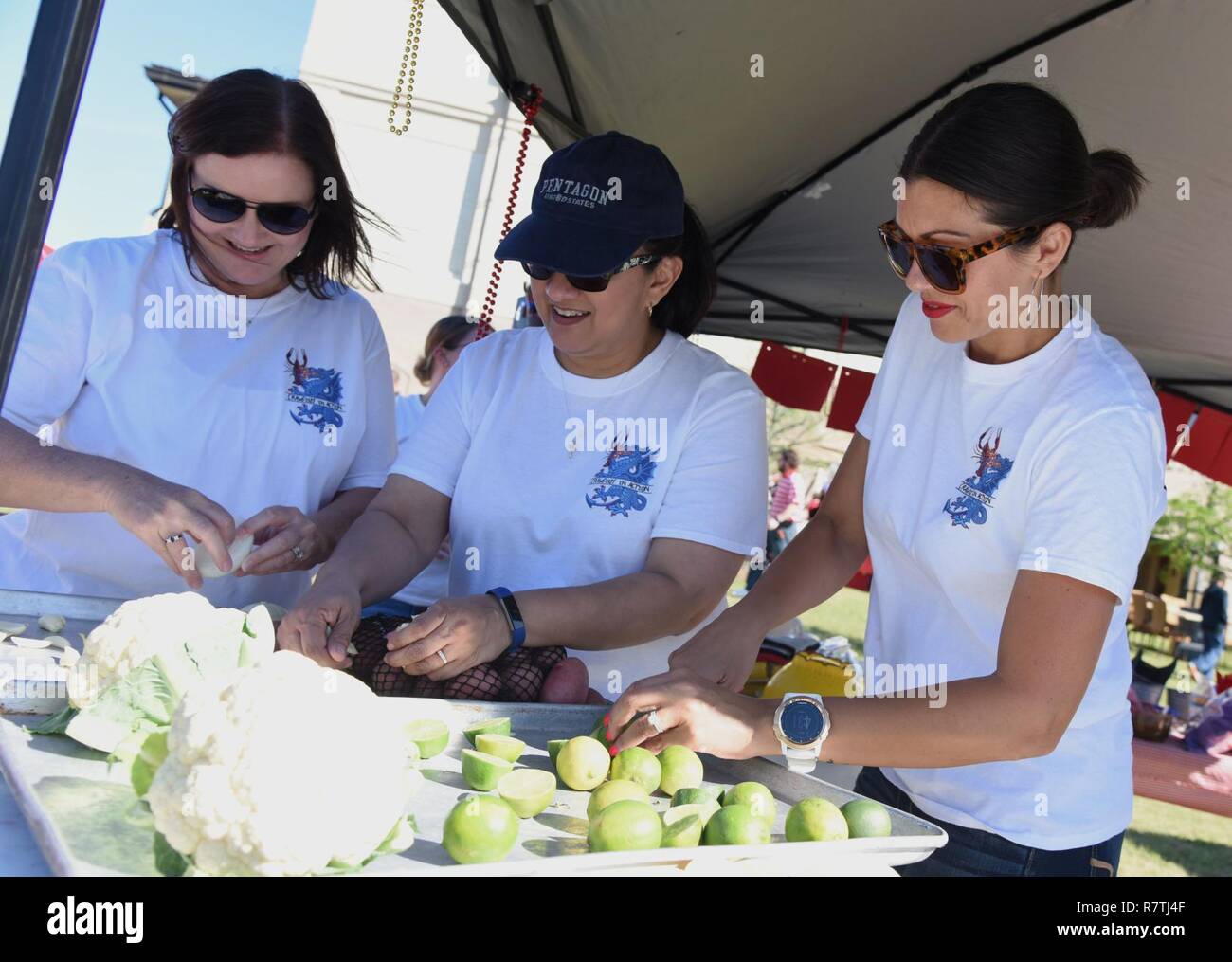 The “Crawfish In Action” team members prepare the ‘fixins’ for their ...