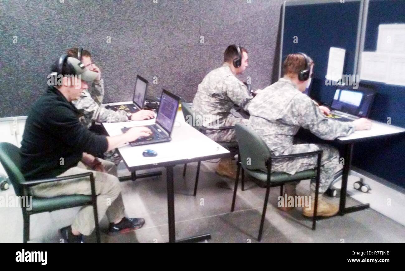 Rob Miller (left), contractor with Booze Allen Hamilton Inc., teaches ...