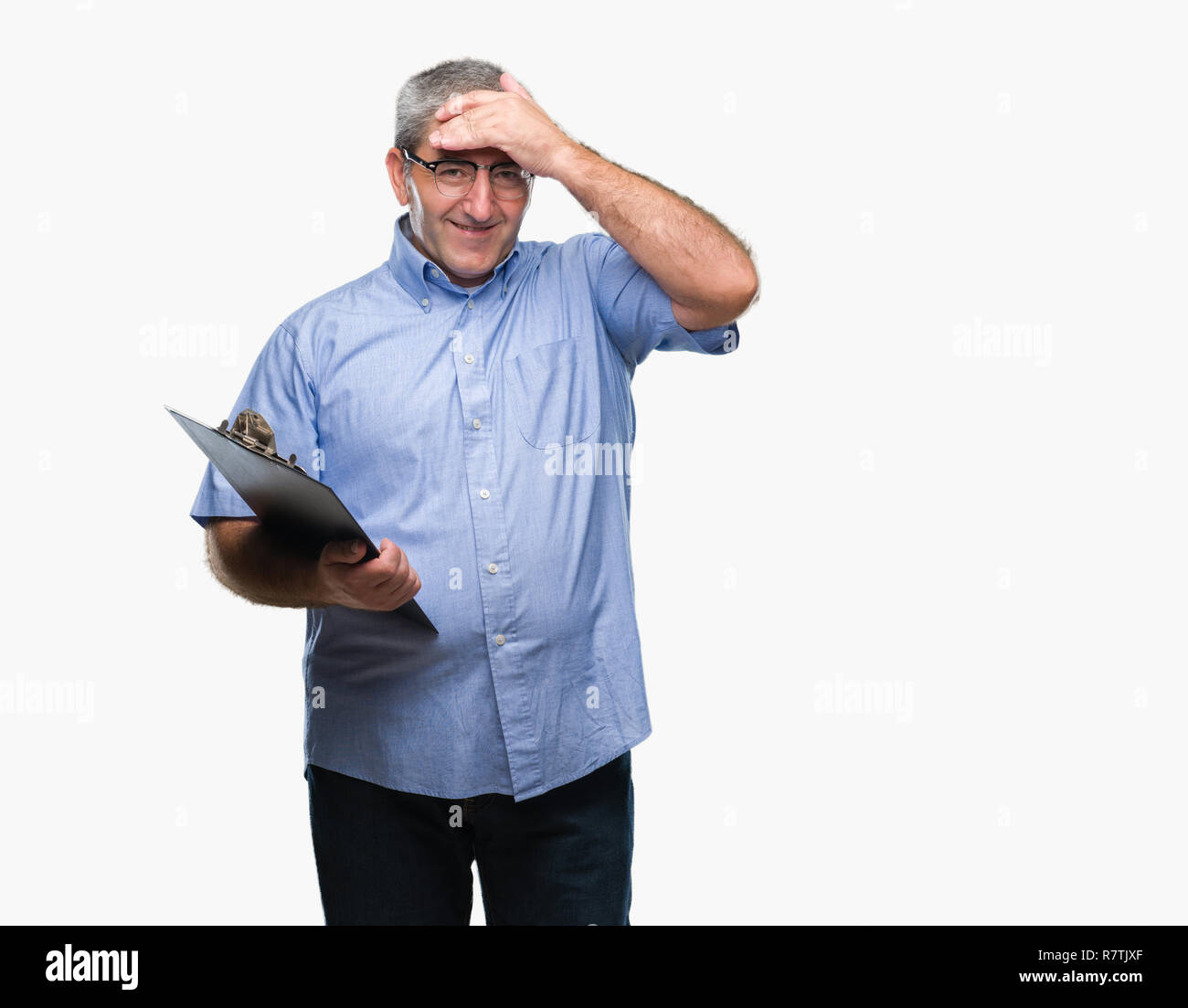 Handsome senior inspector man holding clipboard over isolated ...