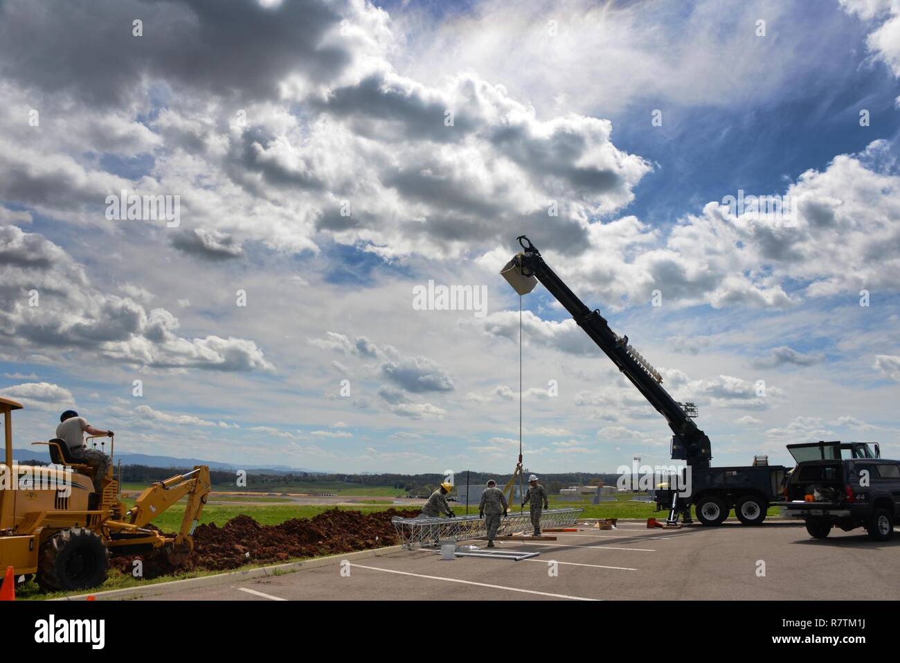 Members of the 241st Engineer Installation Squadron construct and erect ...