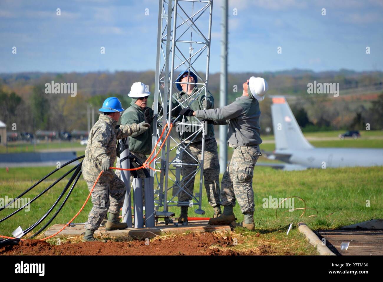 Members of the 241st Engineer Installation Squadron, erect a ...