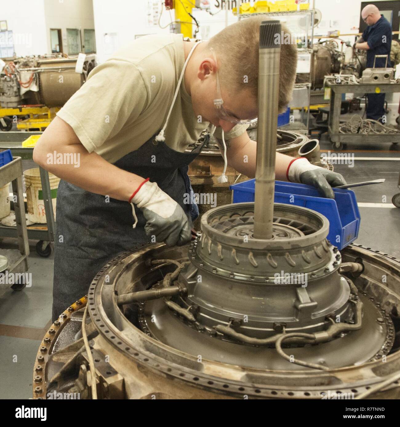 Spc. Daquiry Wright disassembles a rear module of an AGT 1500 turbine ...