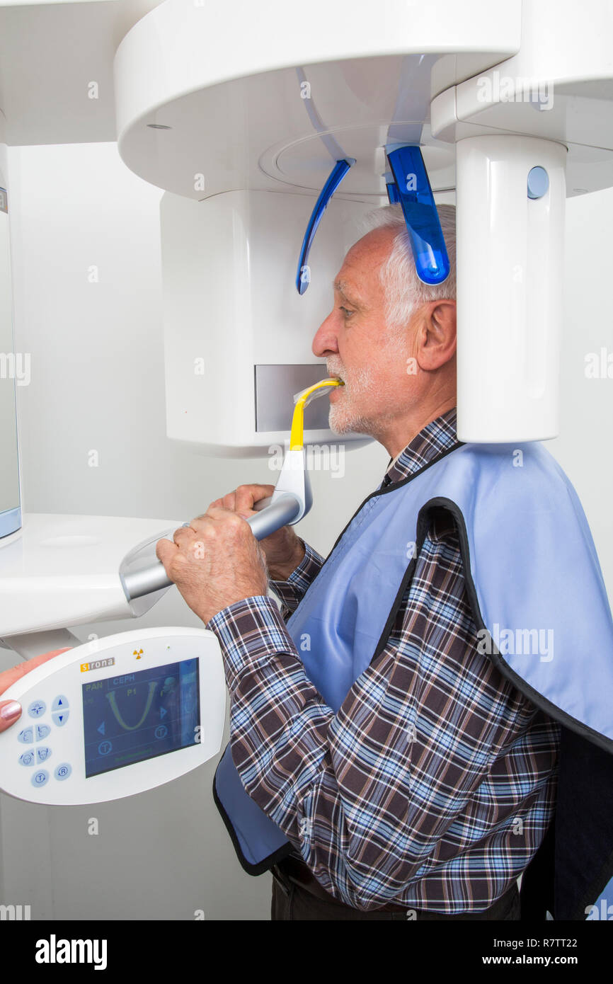 Dental patient wearing lead apron hi-res stock photography and images ...