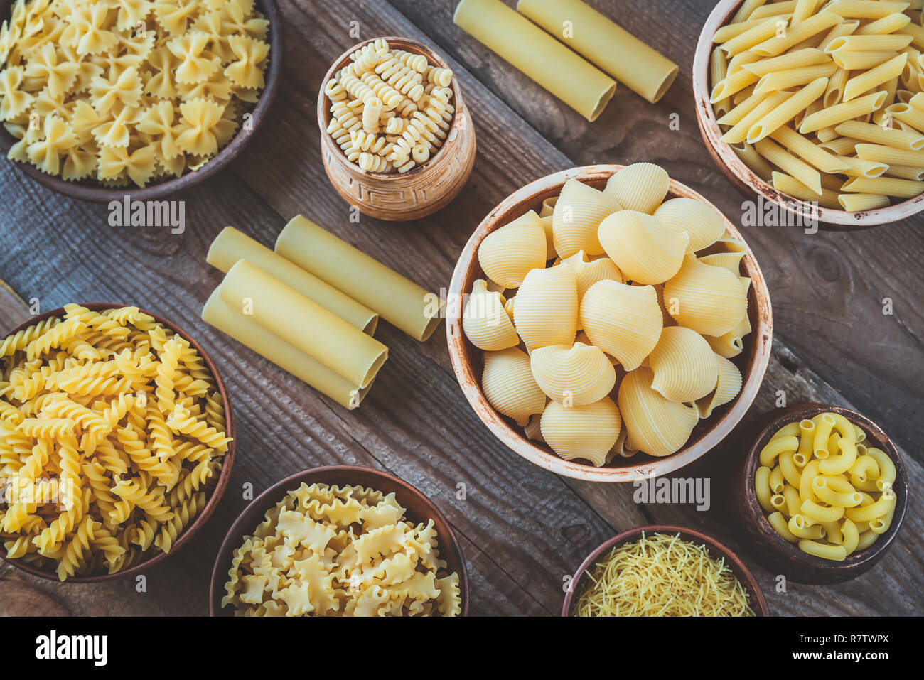 Various types of pasta on the white background Stock Photo - Alamy