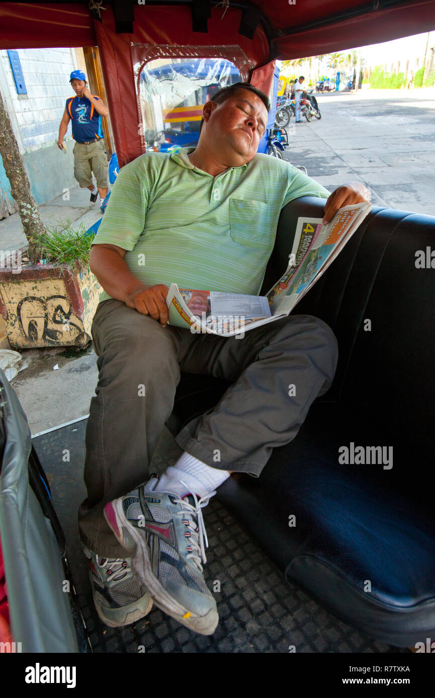 A sleeping taxi driver at Iquitos,Peru Stock Photo - Alamy
