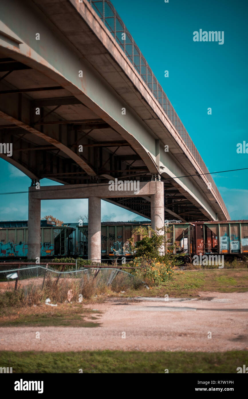 Train Under a Bridge Stock Photo - Alamy