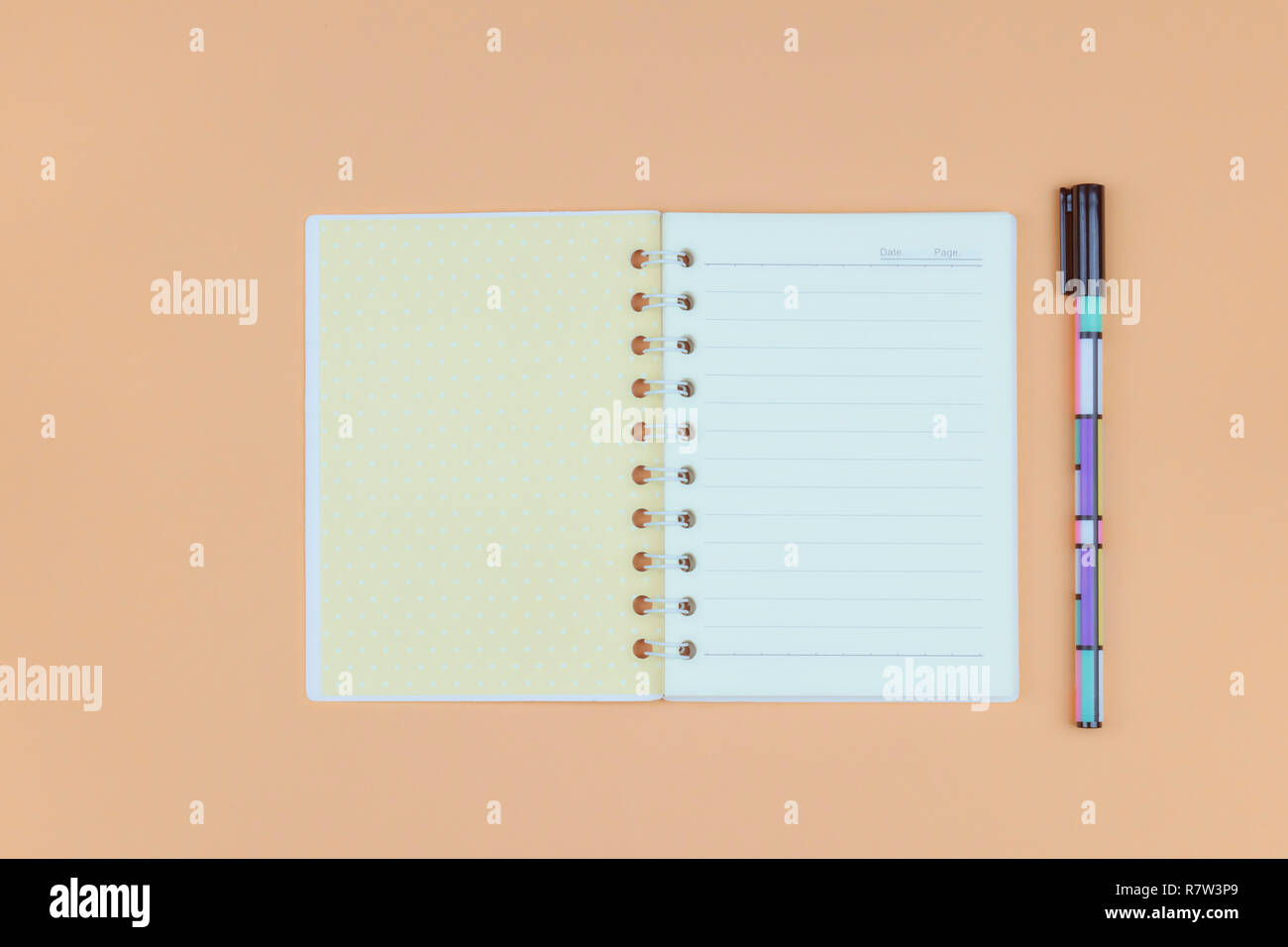 Office desktop New Year's pig, white fox, notebook, pen on the color of ...