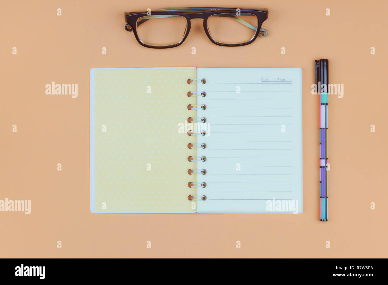 Office desktop New Year's pig, white fox, notebook, pen on the color of ...