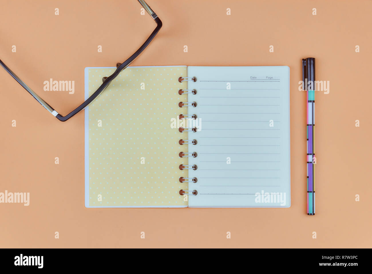 Office desktop New Year's pig, white fox, notebook, pen on the color of ...