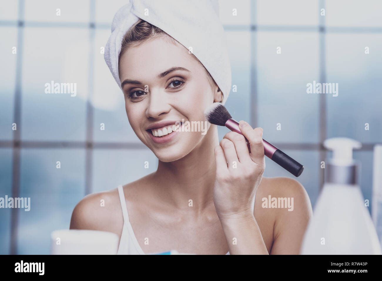 Woman happy cosmetics brush hi-res stock photography and images - Alamy