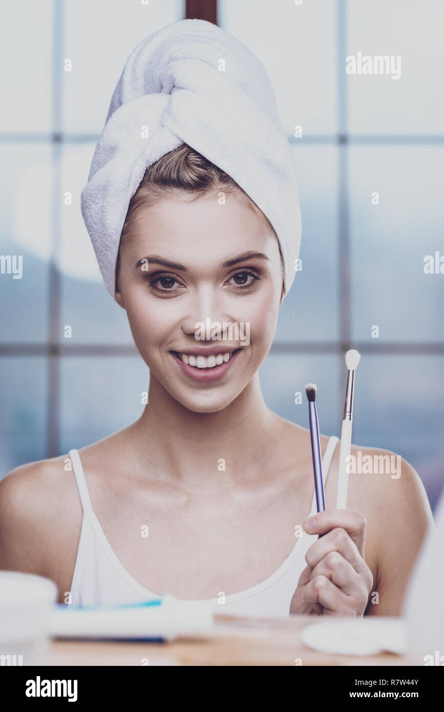 Woman holding brushes hi-res stock photography and images - Alamy